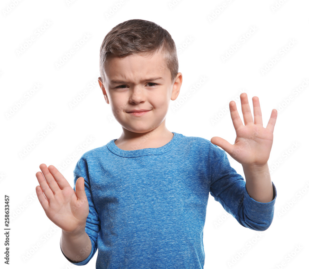 Little boy showing STOP gesture in sign language on white background ...