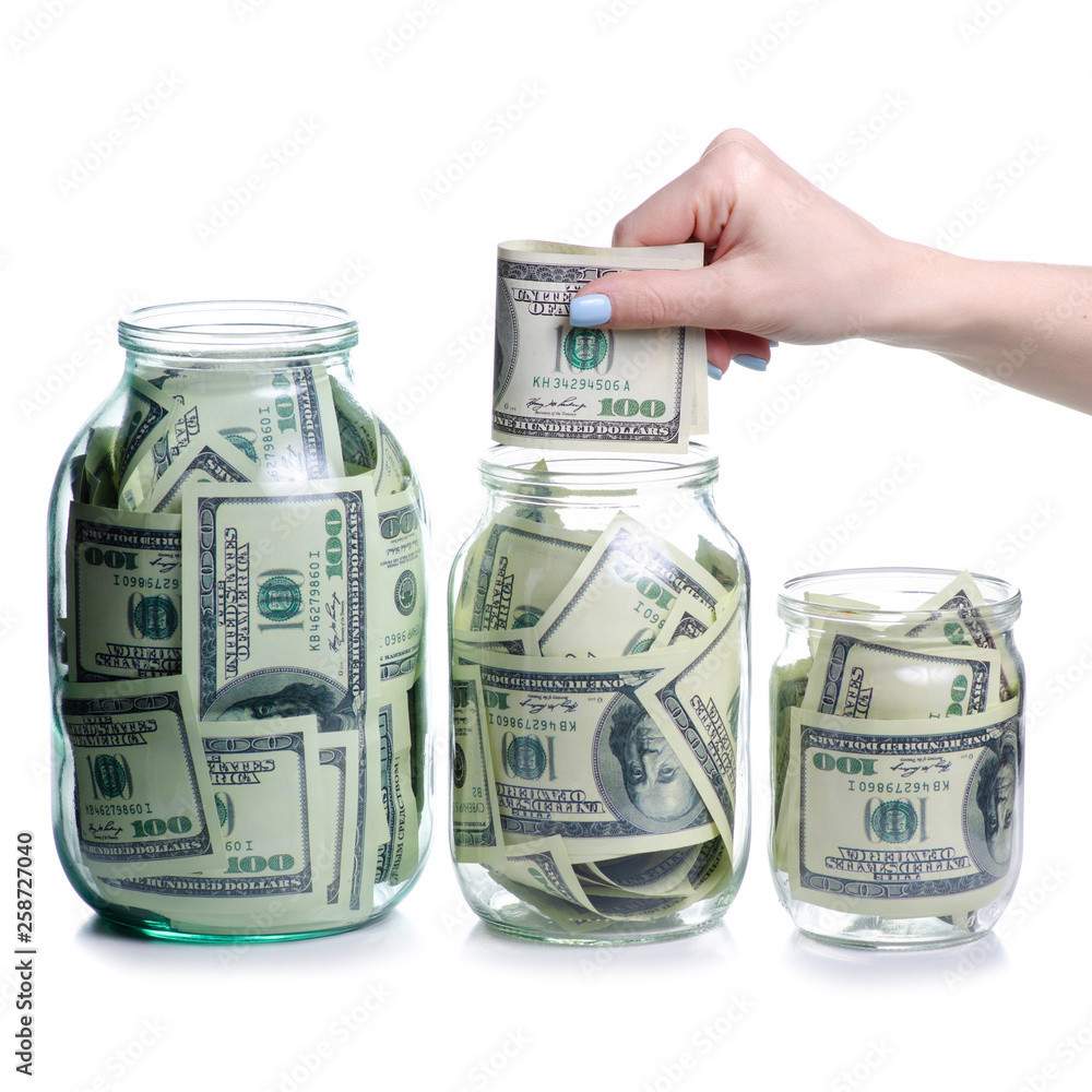 Money dollars bank notes in glass jar, hand put money isolated on white ...