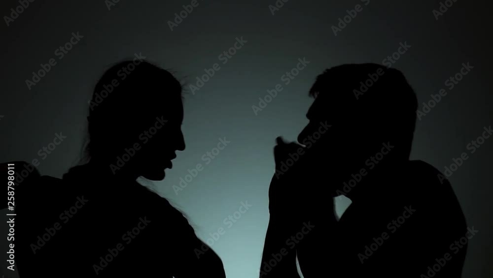 Silhouettes of man and woman. Shadows of men and women on a light ...