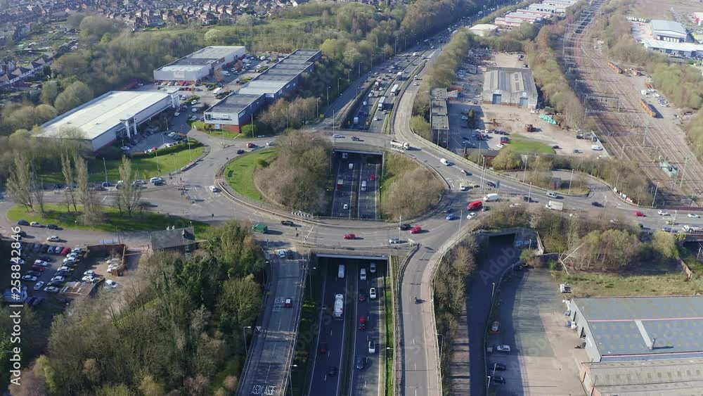 Aerial footage of a large section of commuter motorway, highway, during ...