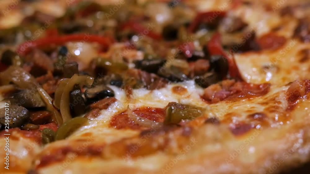 supreme pizza rack focus across pizza close up on crust pepperoni ...