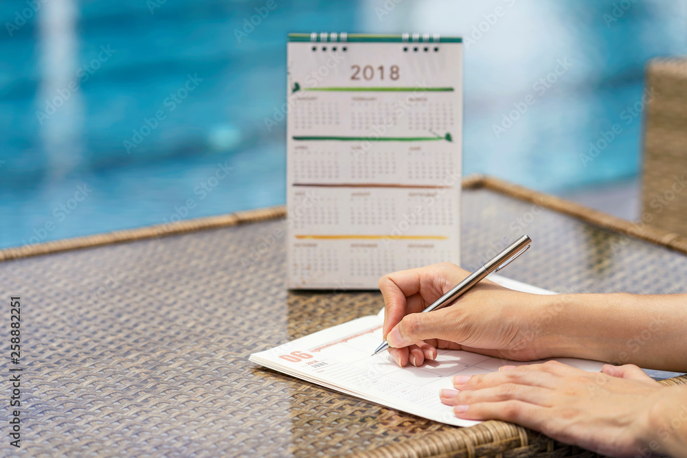 Woman hands writing plan on notebook, planning agenda and schedule ...