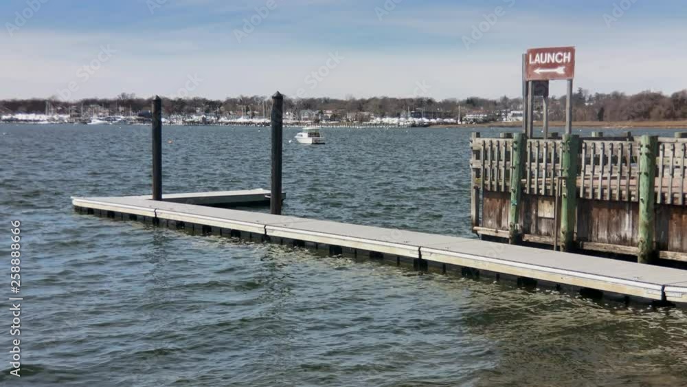 Sign that indicates where boats can LAUNCH in harbor. Wide shot of ...