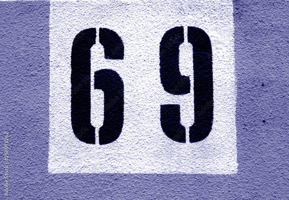 Number 69 on cement wall in stencil in blue tone. Stock Photo | Adobe Stock