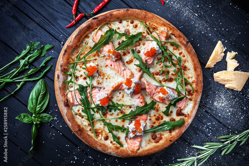 Top view on fresh homemade italian pizza with salmon and caviar. Pizza ...