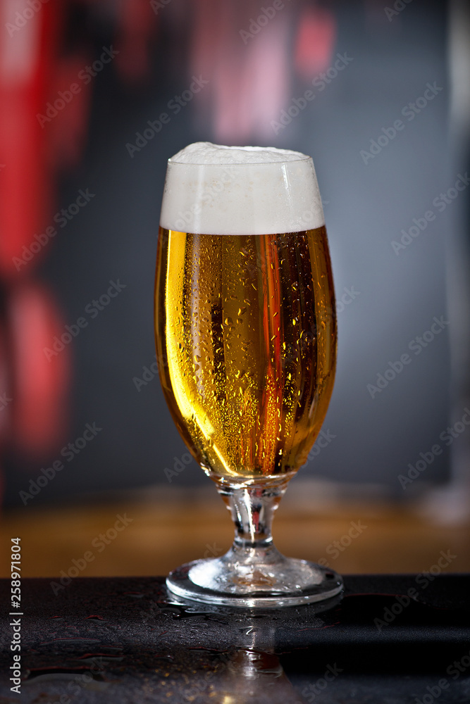Glass of beer on the dark background Stock Photo | Adobe Stock