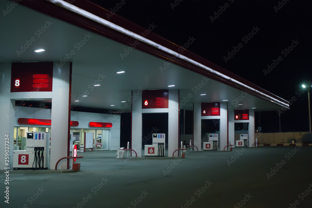 Illuminated gas station at night. Stock Photo | Adobe Stock