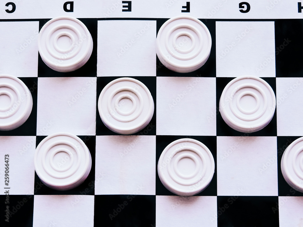 Checkerboard with checkers. Business strategy competition, strategic ...