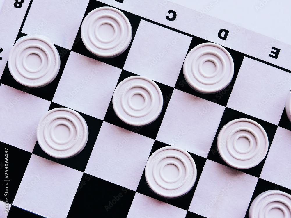 Checkerboard with checkers. Business strategy competition, strategic ...
