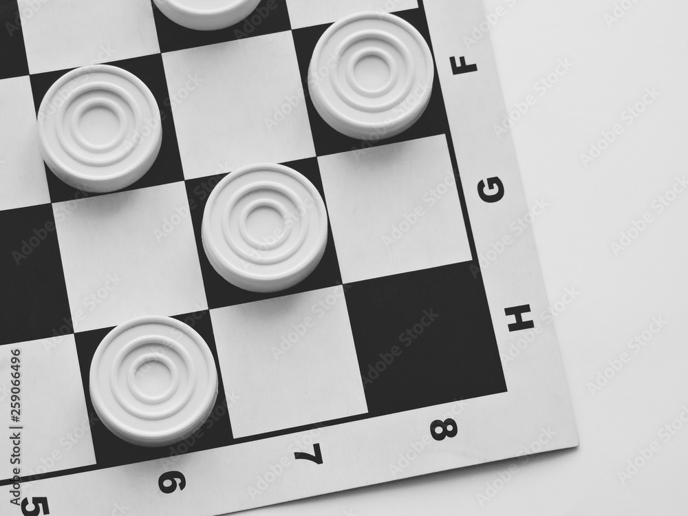 Checkerboard with checkers. Business strategy competition, strategic ...