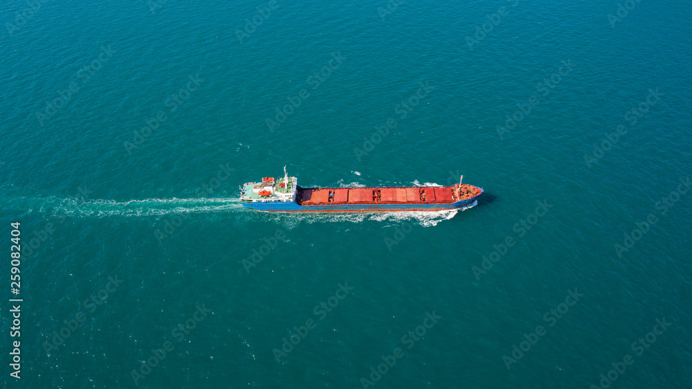 Aerial top view container ship full speed and beautiful wave on the sea ...