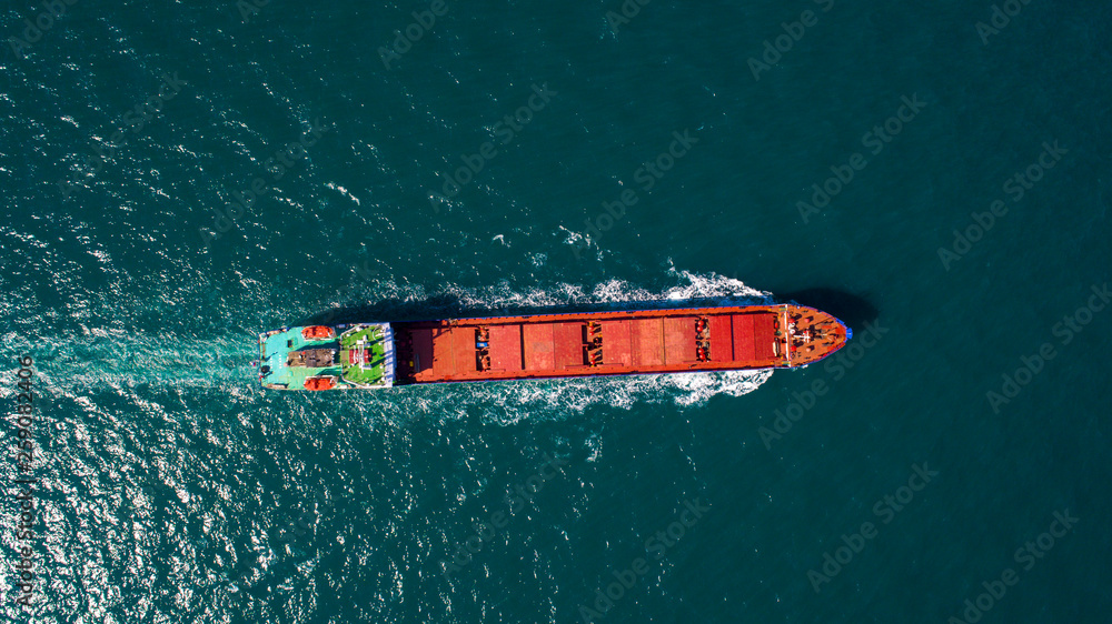 Aerial top view container ship full speed and beautiful wave on the sea ...