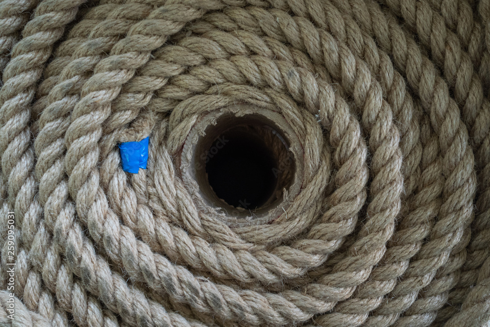 The thick rope twisted in a roll. The top view on a rope spiral. The ...