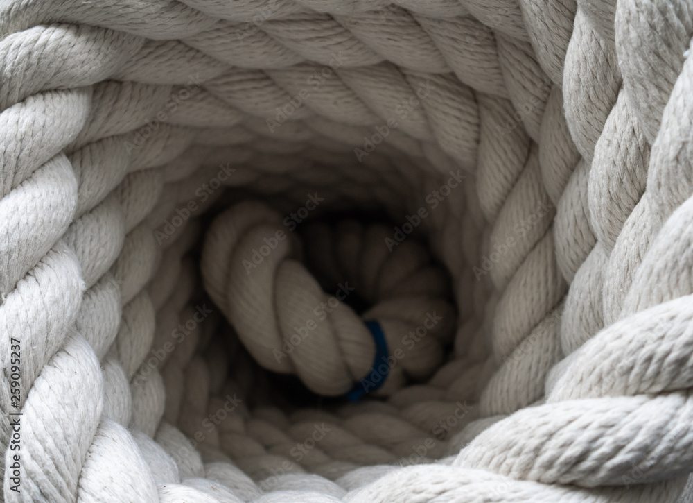 The thick rope twisted in a roll. The top view on a rope spiral. The ...