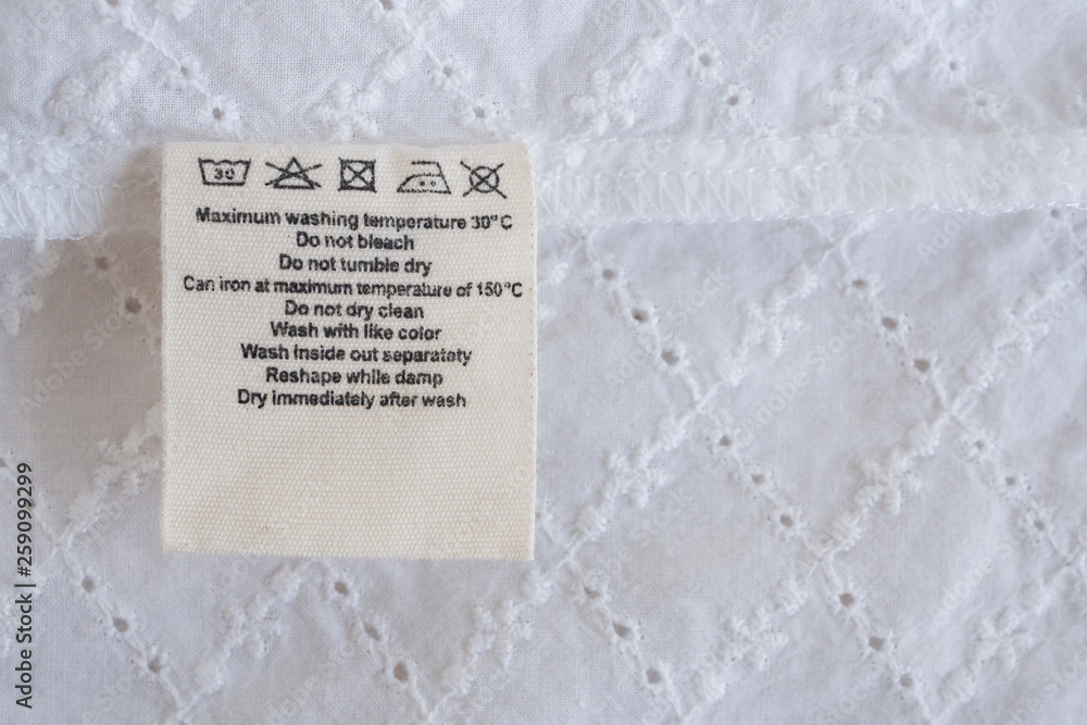 laundry care washing instructions clothes label on fabric texture ...