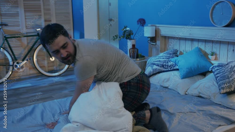 Young thirsty man waking up at night, looking for water. Friend ...