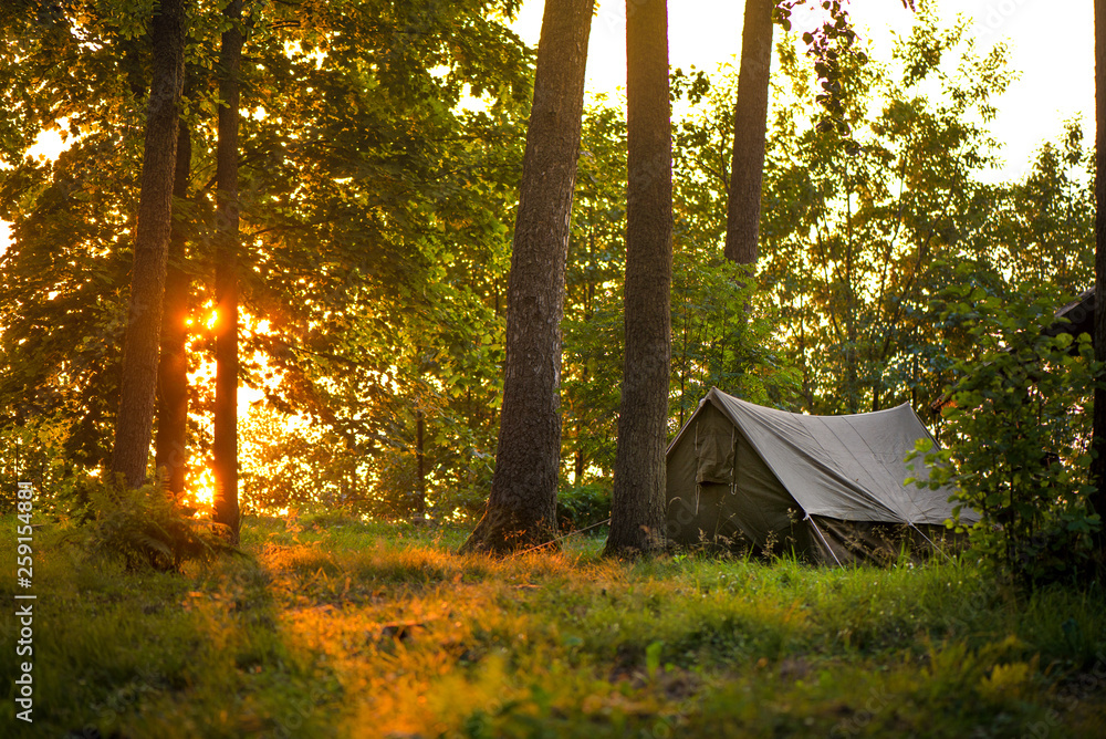 Camping on the beach during the sunset or sunrise. Bright sunlight ...
