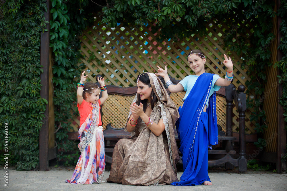 Small children and their mother in traditional Indian attire. Stock ...