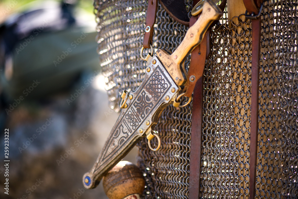 Silver or bronze medieval dagger with ornaments attached to chain ...