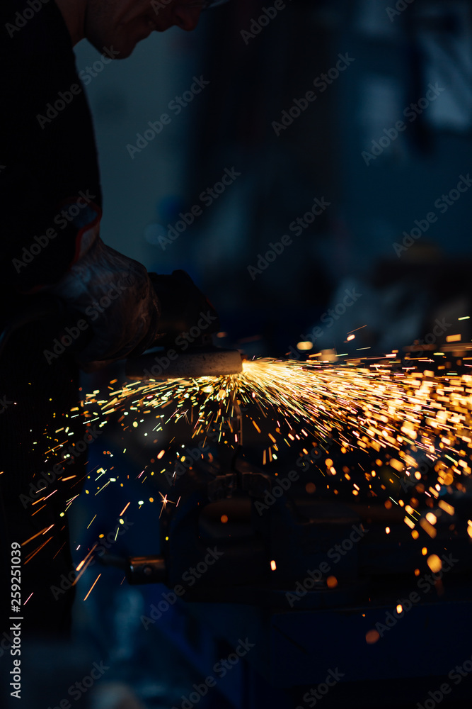 Using a grinding machine industrial Stock Photo | Adobe Stock