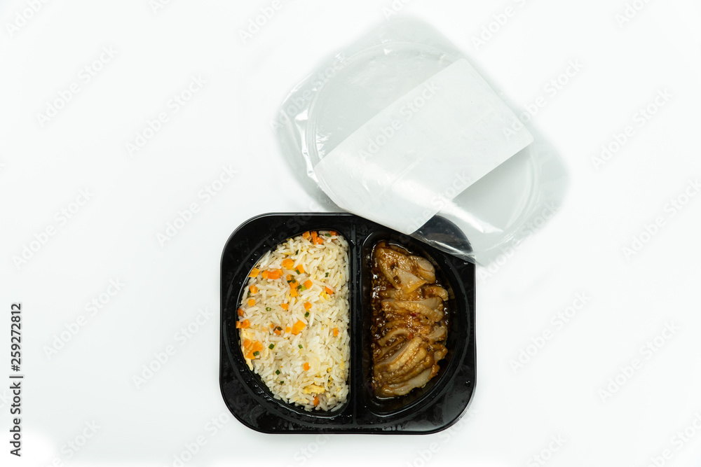 Top view Ready to eat chilled fried rice with chicken in plastic box ...