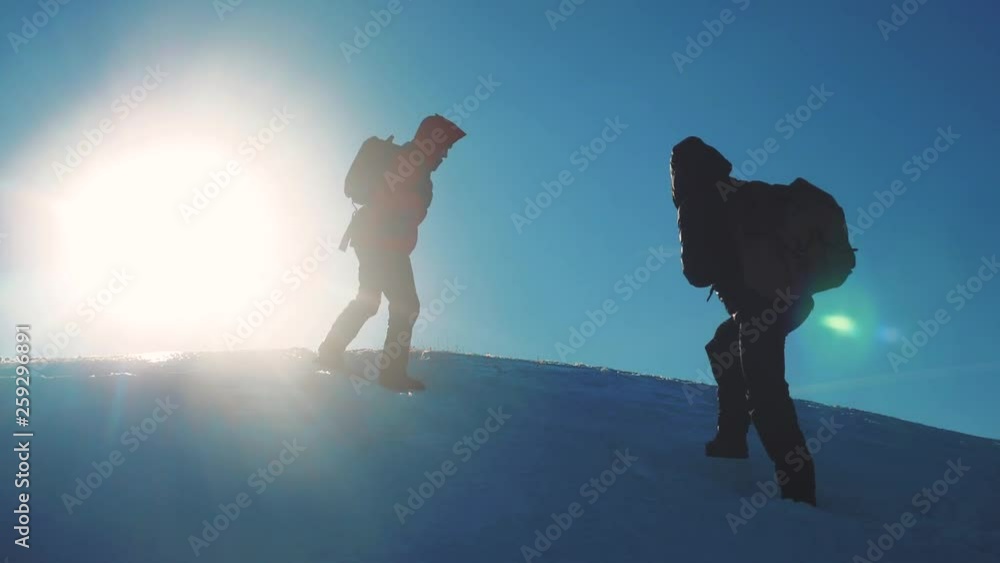 teamwork business winter trip. men tourists climbing walking top ...
