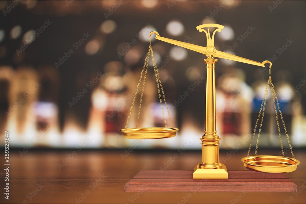 Law scales on table background. Symbol of justice Stock Photo | Adobe Stock