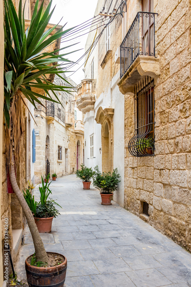 Beautiful typical narrow street in Rabat, Malta, streetscape detail ...