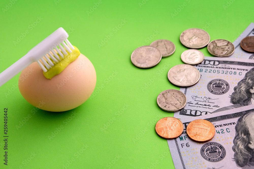 Toothbrush with toothpaste is on the whole egg. A symbol of the ...