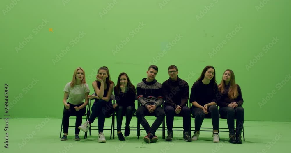 GREEN SCREEN CHROMA KEY Front view group of young people watching and ...