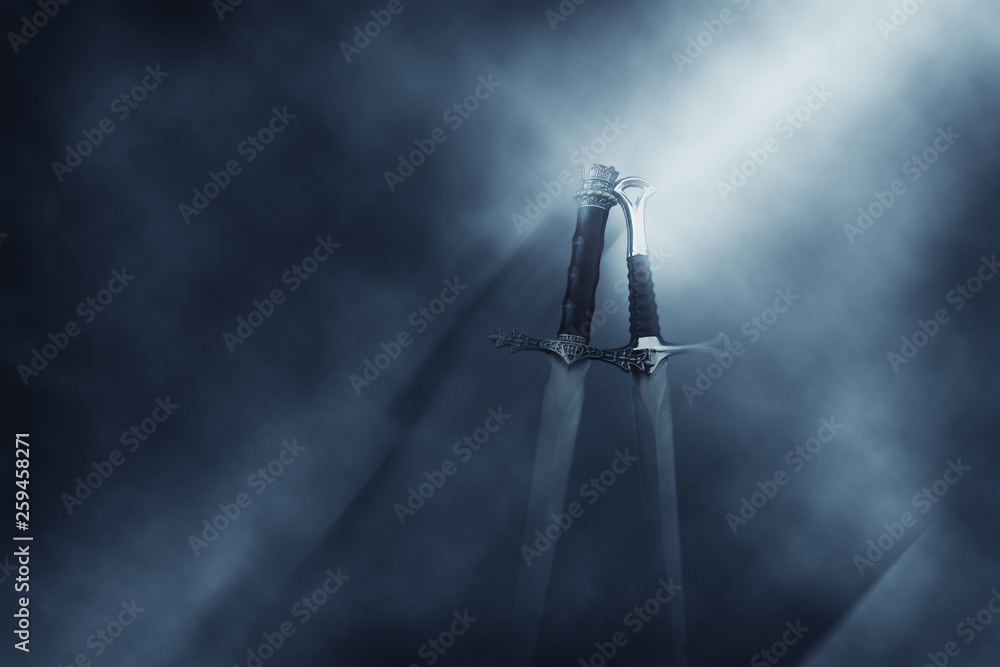 mysterious and magical photo of silver sword over gothic black ...