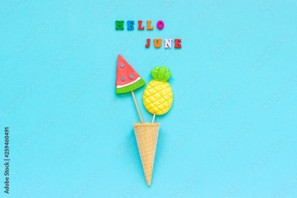 Hello June colorful text, pineapple and watermelon lollipops in ice ...