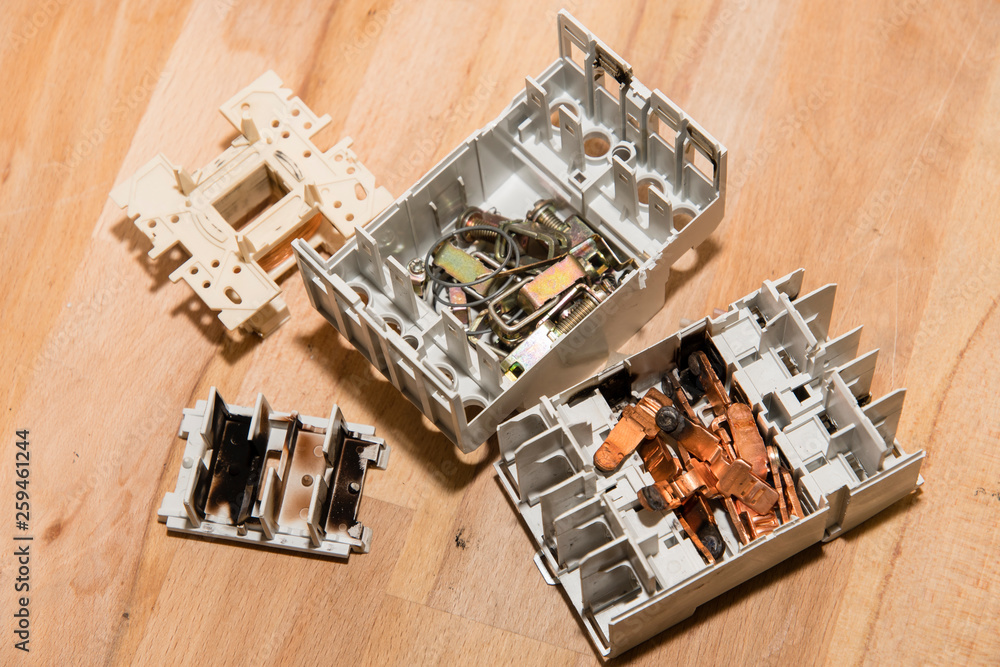 Exploded burnt electric contactor. Stock Photo | Adobe Stock