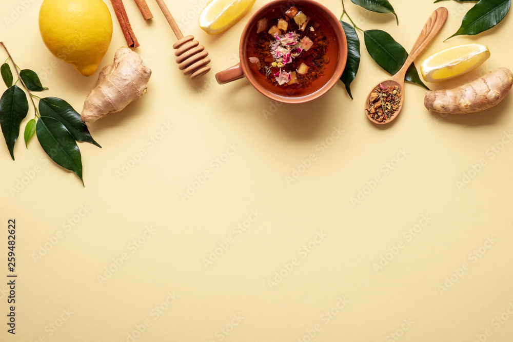 Foto Stock Teacup and tea accessories on yellow background, top border ...