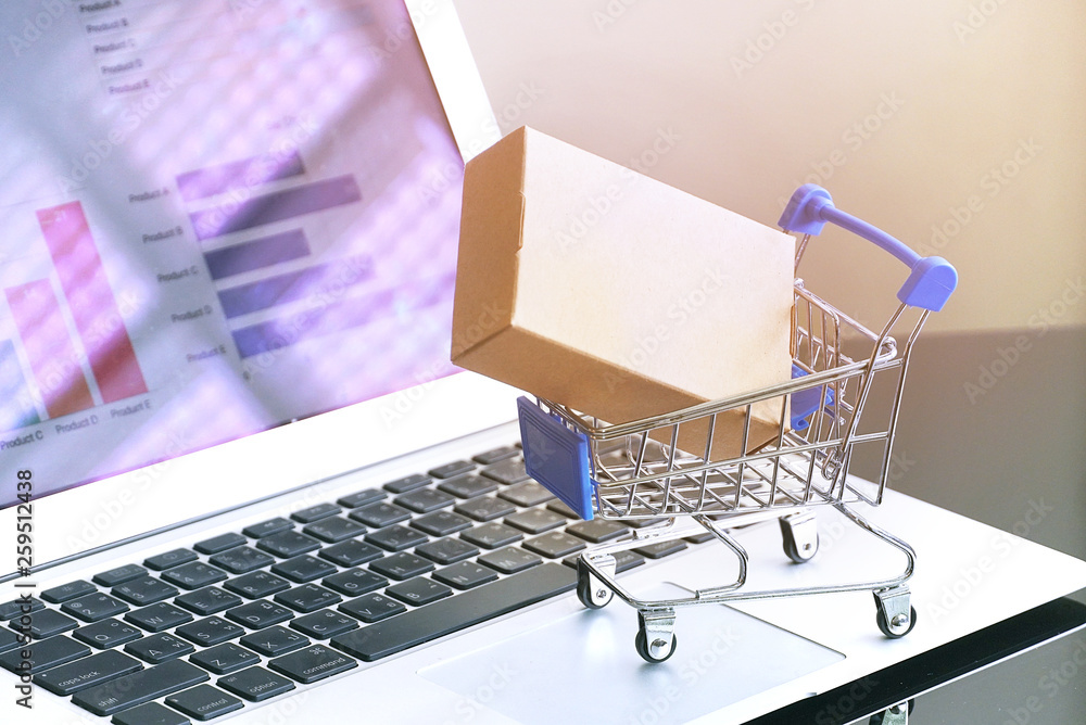 Packaging box on shopping cart with background computer screen,online ...
