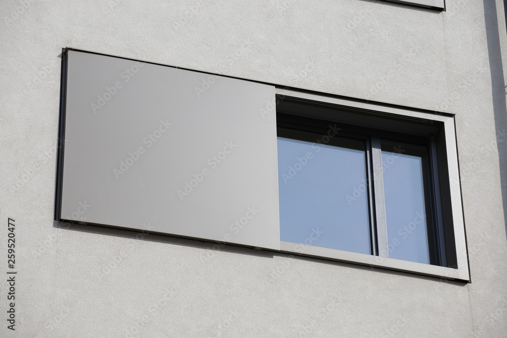 Windows with modern sliding shutters Stock Photo | Adobe Stock