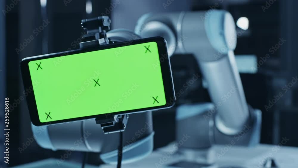 Robot Arm Holding Green Mock-up Screen Smartphone in Landscape Mode ...