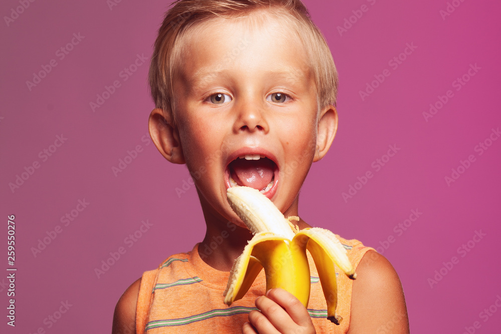 Vegan boy, sweet tooth concept. Funny portrait of smiling kid with ...