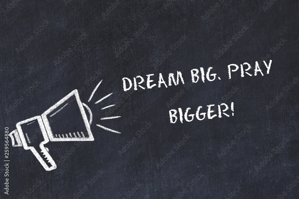 Chalk board sketch with loudspeaker and motivational phrase dream big ...