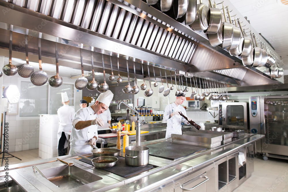 work of a group of chefs in a luxury restaurant. Stock Photo | Adobe Stock