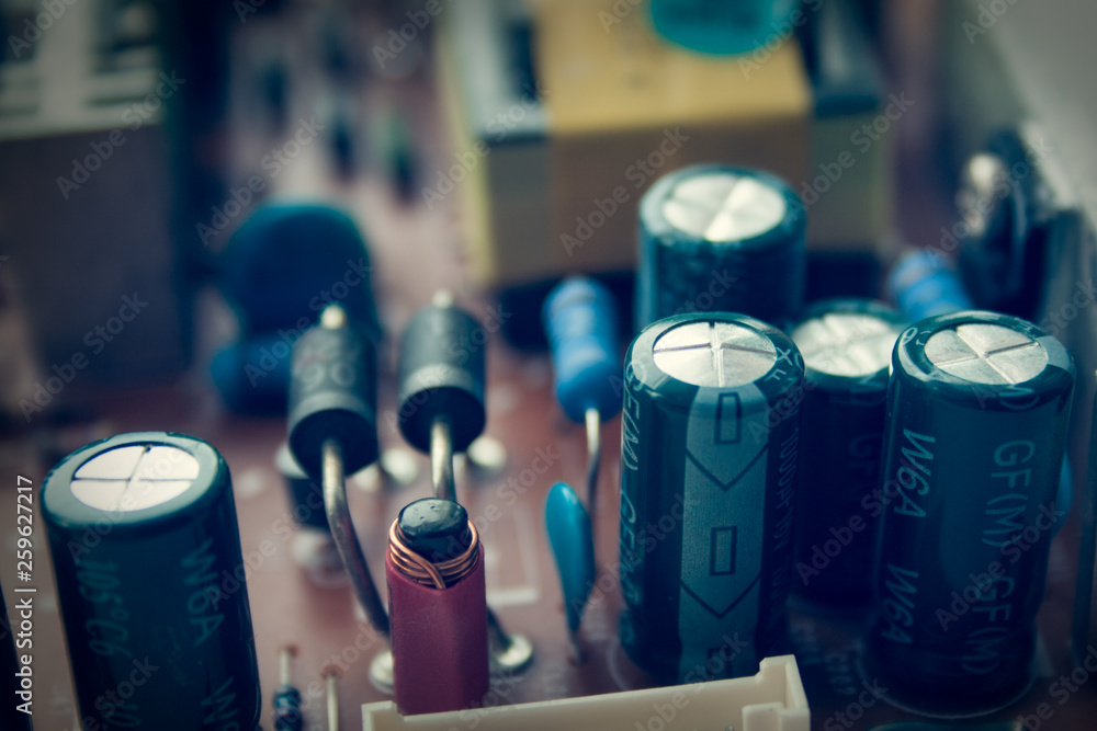 Broken bad old capacitor of computer screen. condenser breakdown ...