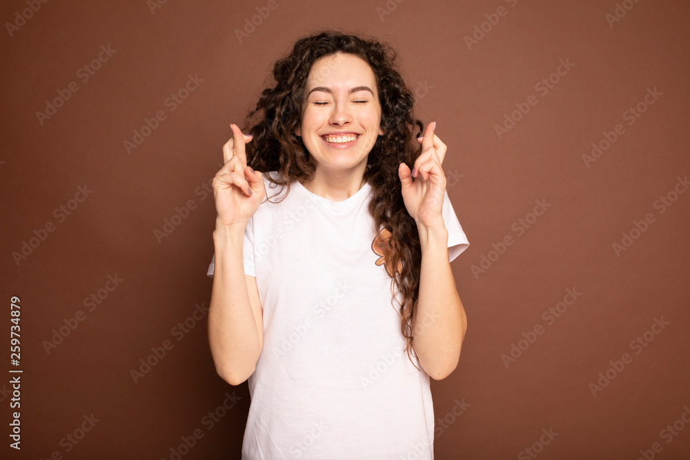 Closeup portrait hopeful beautiful woman crossing her fingers, eyes ...
