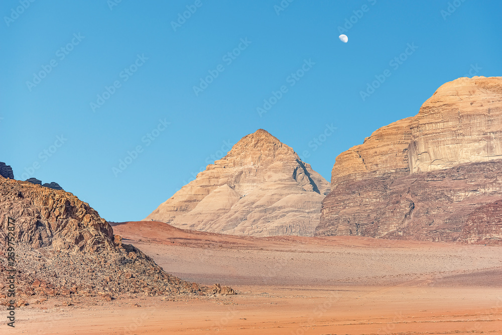 incredible lunar landscape with huge moon in Wadi Rum village in the ...