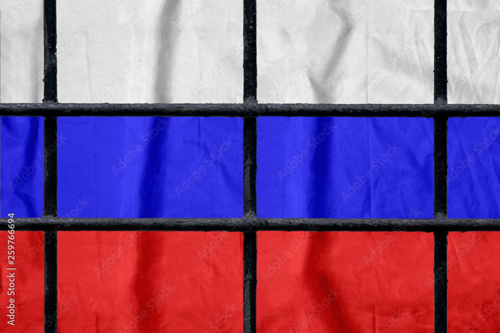 Russian flag behind black metal bars of a prison grate without shadows ...