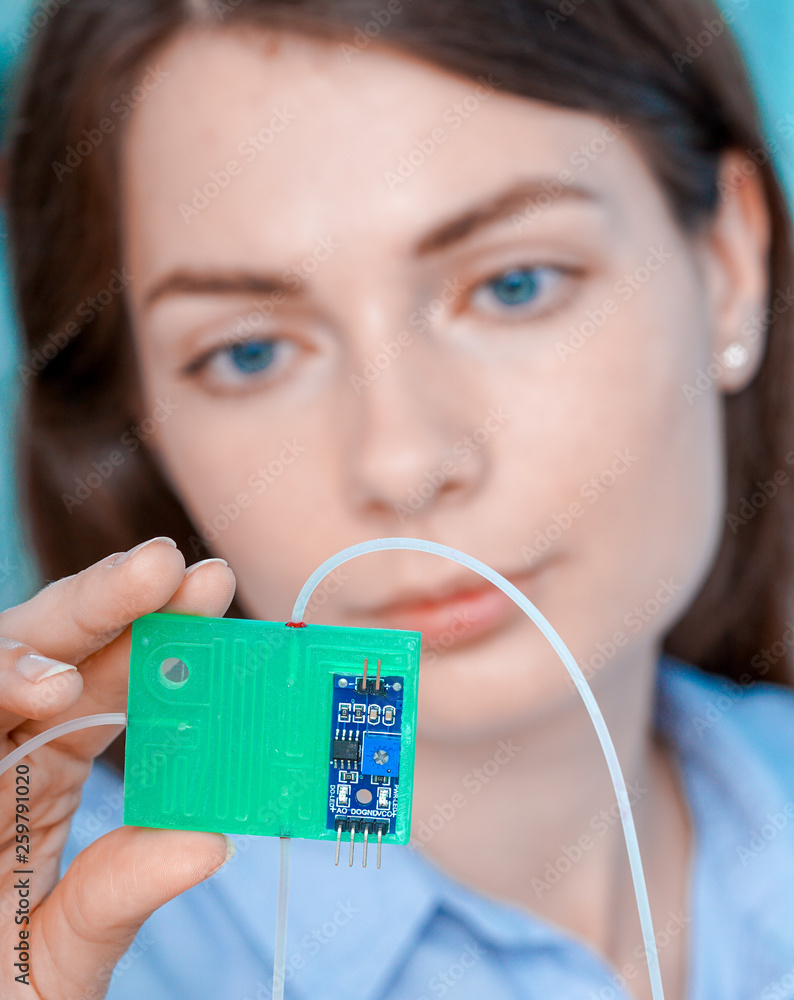 Girl holding polymers Bio-MEMS biomedical microelectromechanical ...