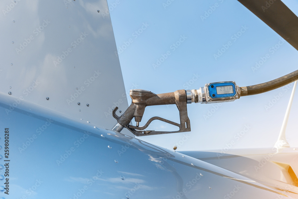 Helicopter being fueled. Refueling a helicopter. Fuel of aviation ...