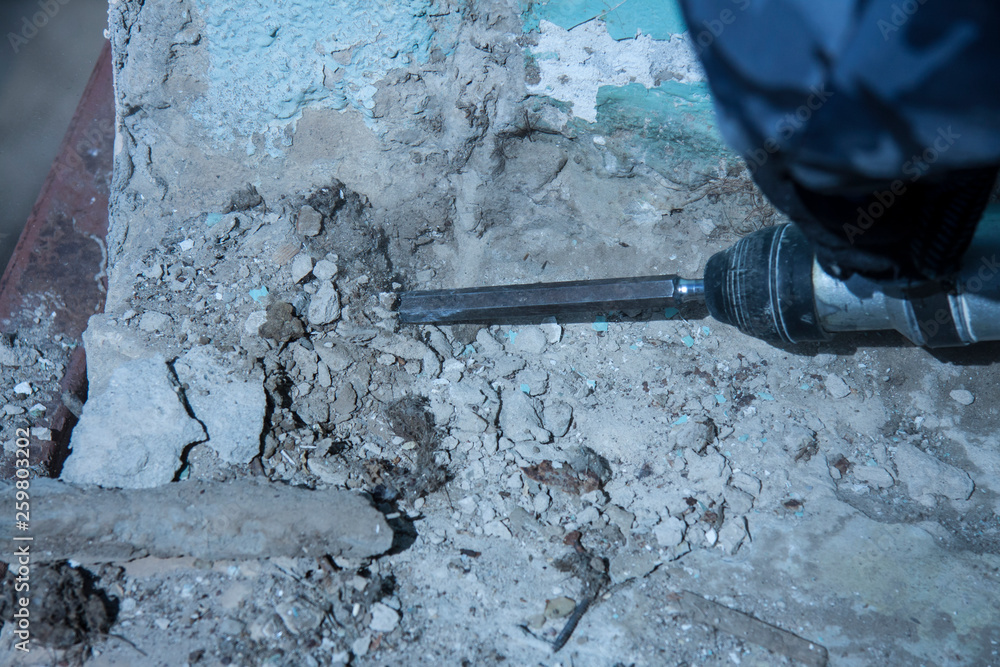 Repair and construction working indoors. Grunge background rubble and ...