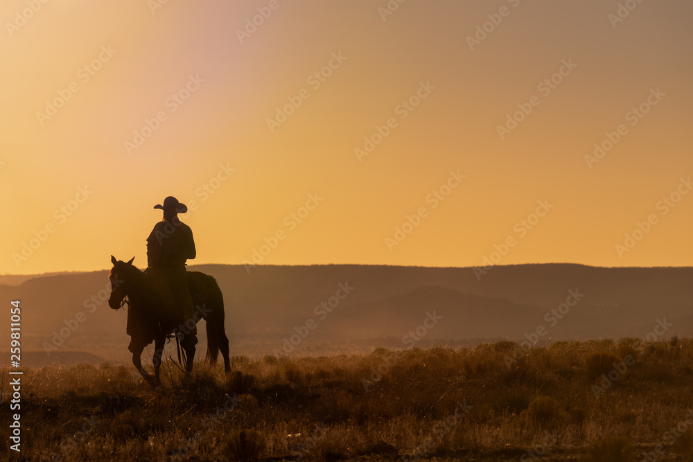 Lone Desert Cowboy Riding At Sunrise Stock Photo | Adobe Stock