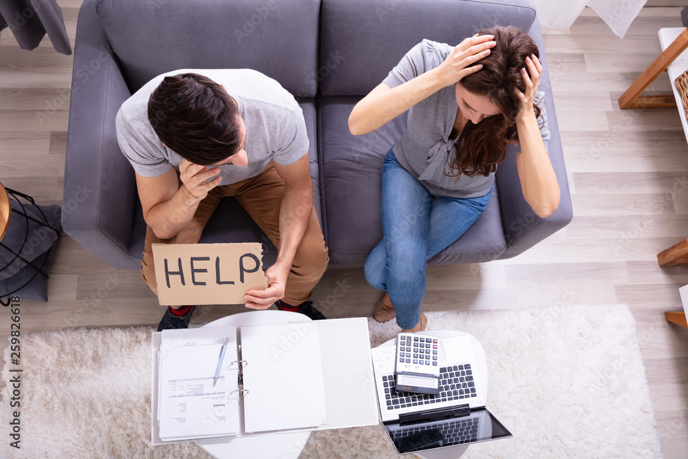 Couple Holding Help Sign While Calculating Invoice Stock Photo | Adobe ...