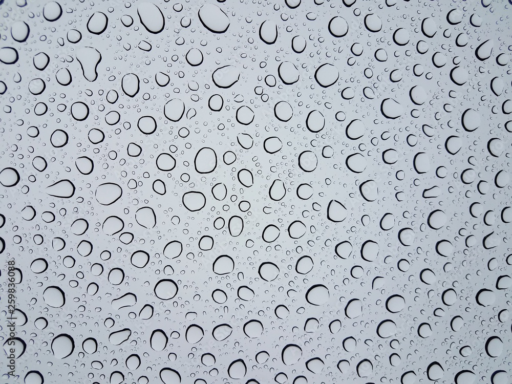 circular water droplets or drops on glass window from rain Stock Photo ...